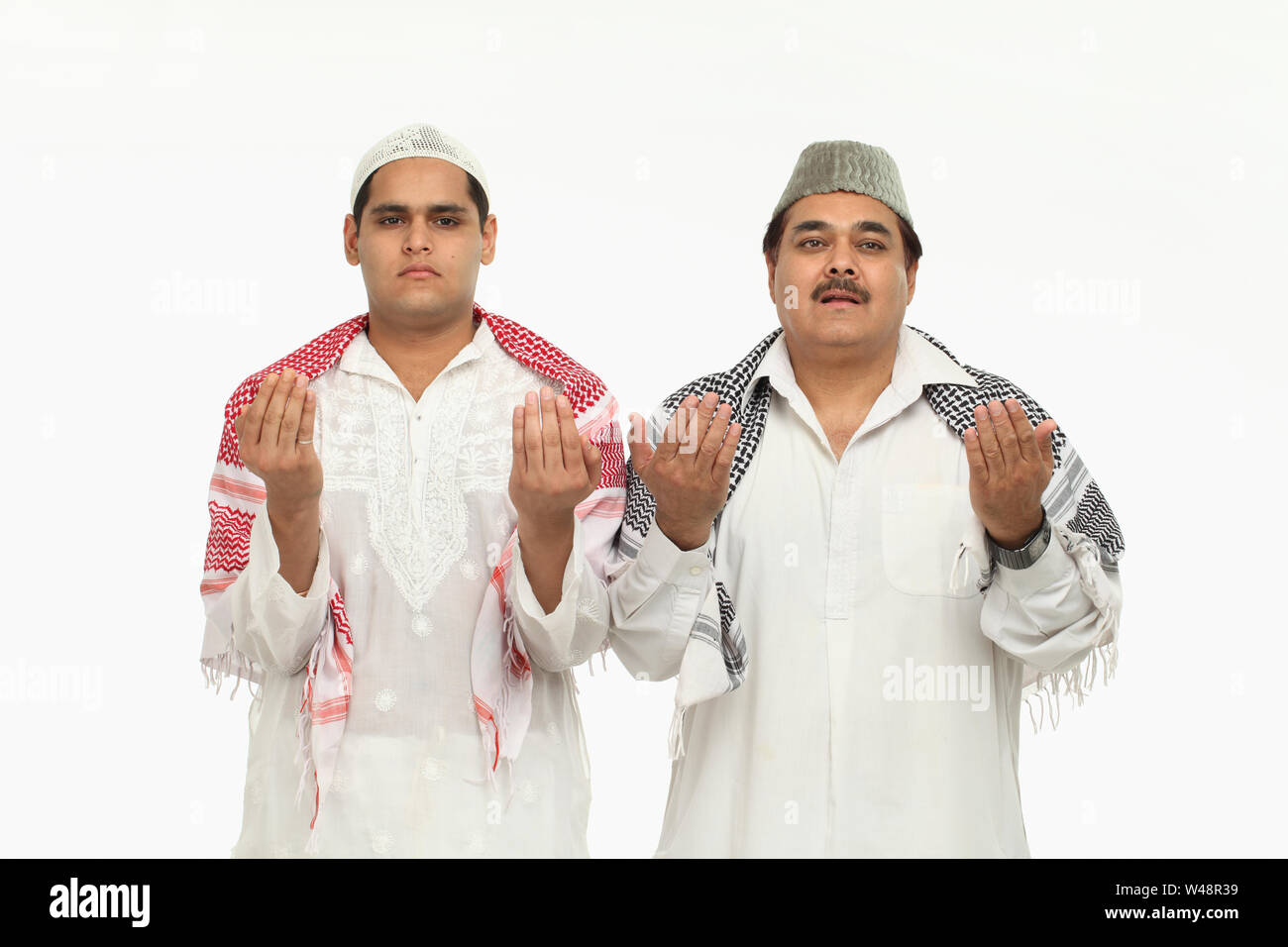 Two Muslim men praying namaz Stock Photo - Alamy