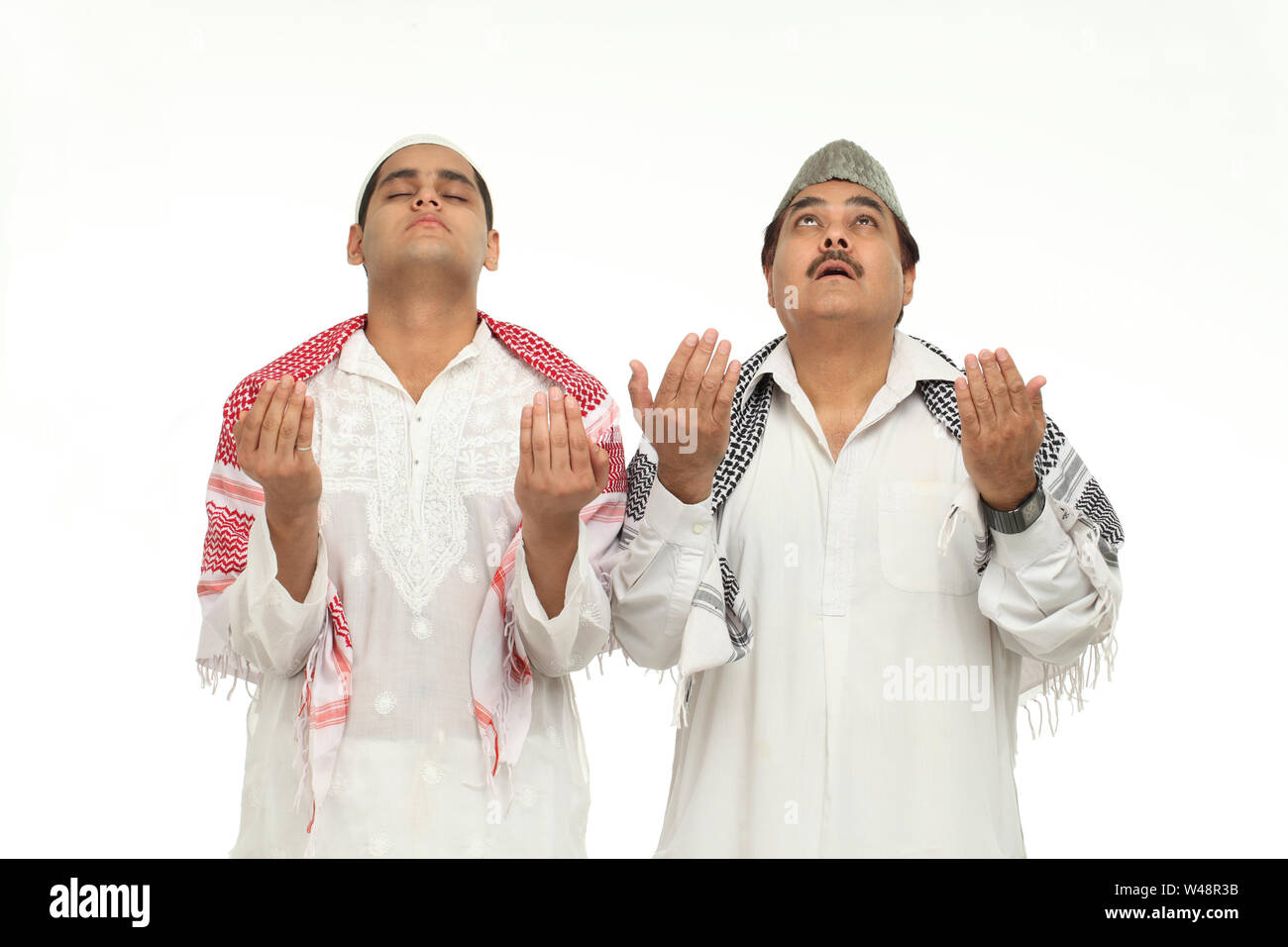 Two Muslim men praying namaz Stock Photo - Alamy