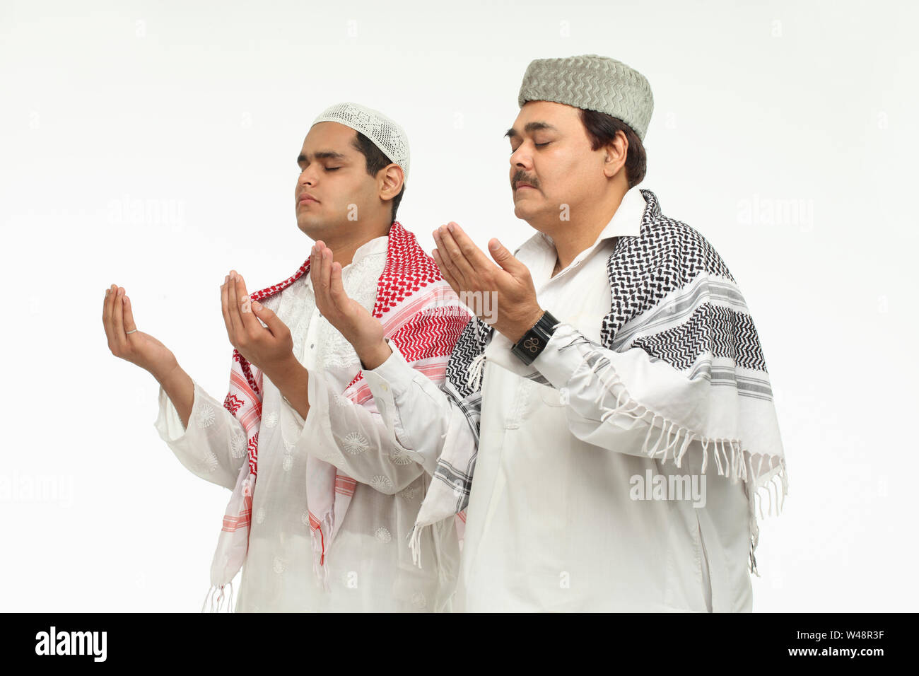 Two Muslim men praying namaz Stock Photo - Alamy