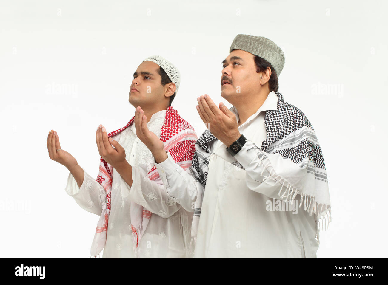 Two Muslim men praying namaz Stock Photo - Alamy