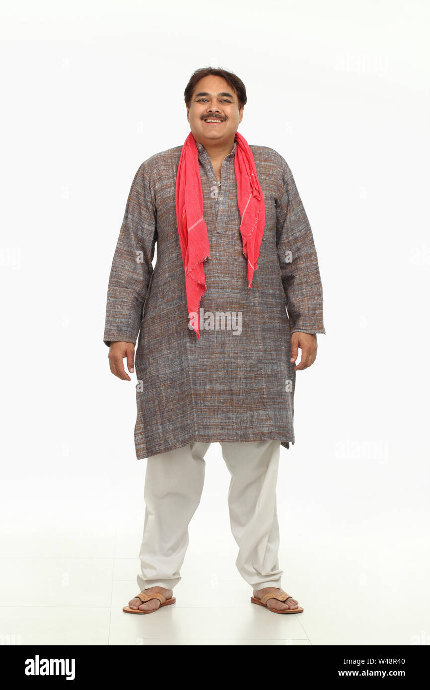 Rural man standing and smiling Stock Photo - Alamy