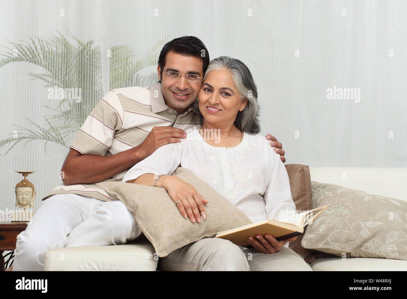 Portrait of a man smiling with his mother Stock Photo - Alamy