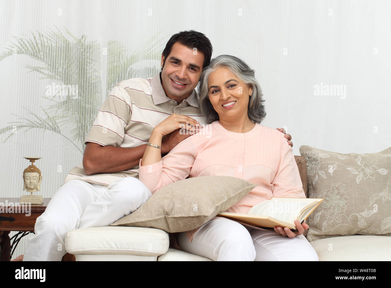 Portrait of a man smiling with his mother Stock Photo - Alamy