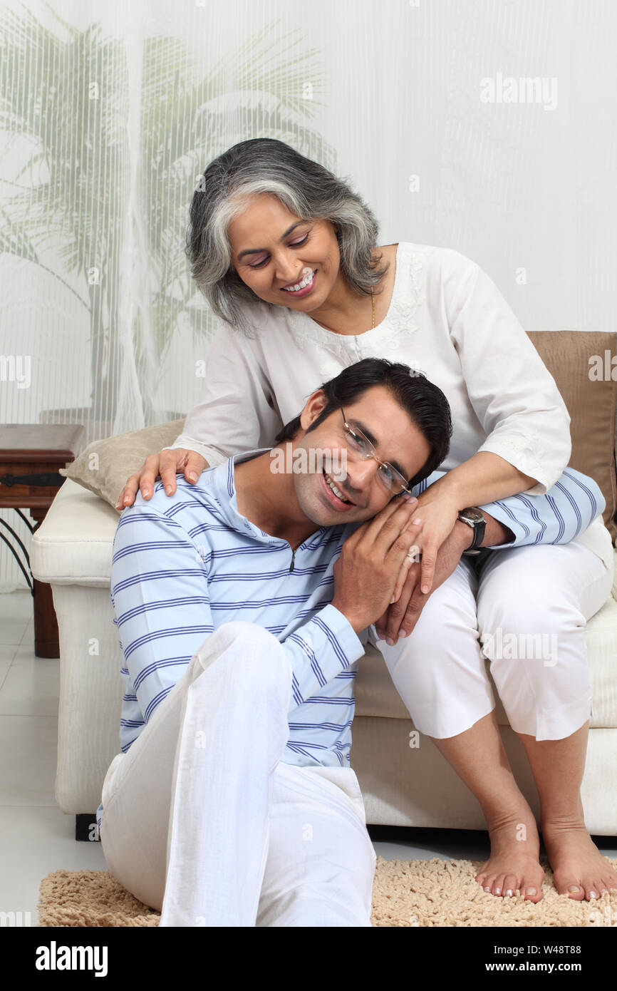 Man smiling with his mother Stock Photo - Alamy