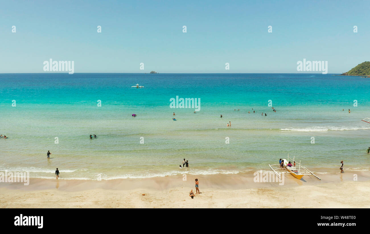Beautiful tropical beach in cove with blue lagoon and turquoise water ...