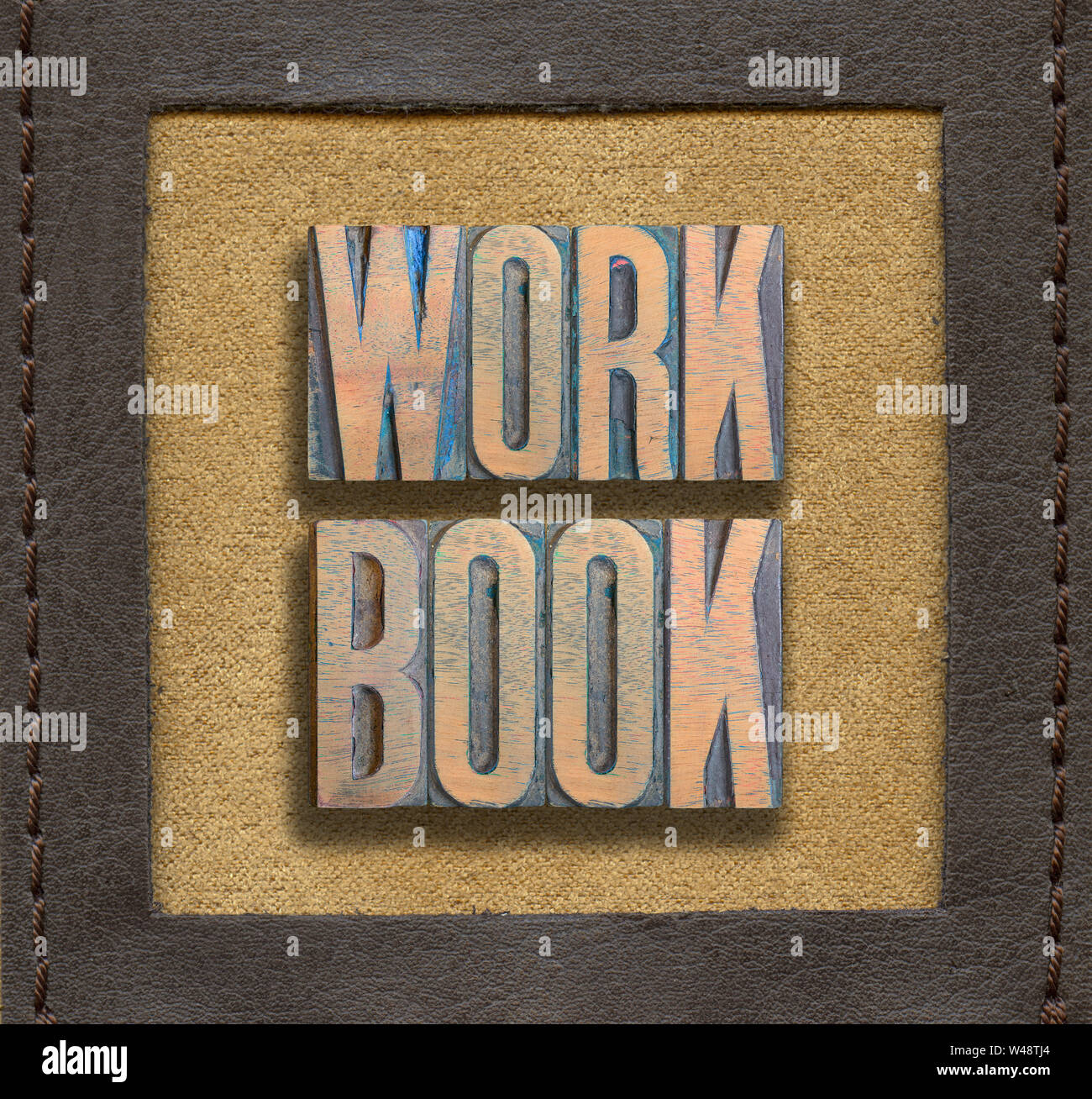 work book word made from vintage wooden letterpress inside stitched ...