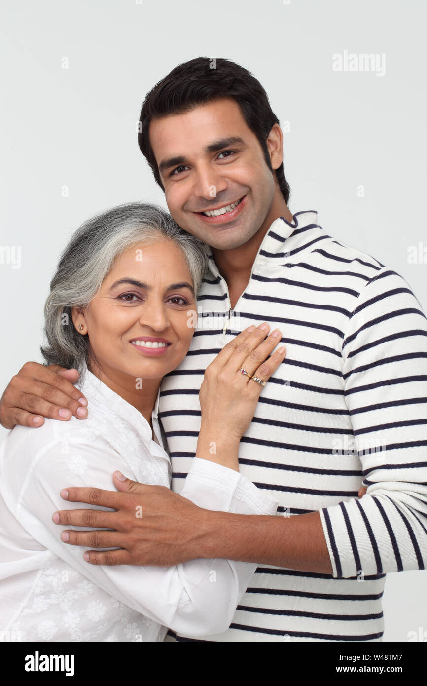 Man hugging his mother Stock Photo - Alamy