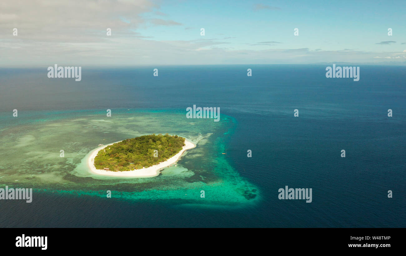 Beautiful beach on tropical island surrounded by coral reef, top view ...