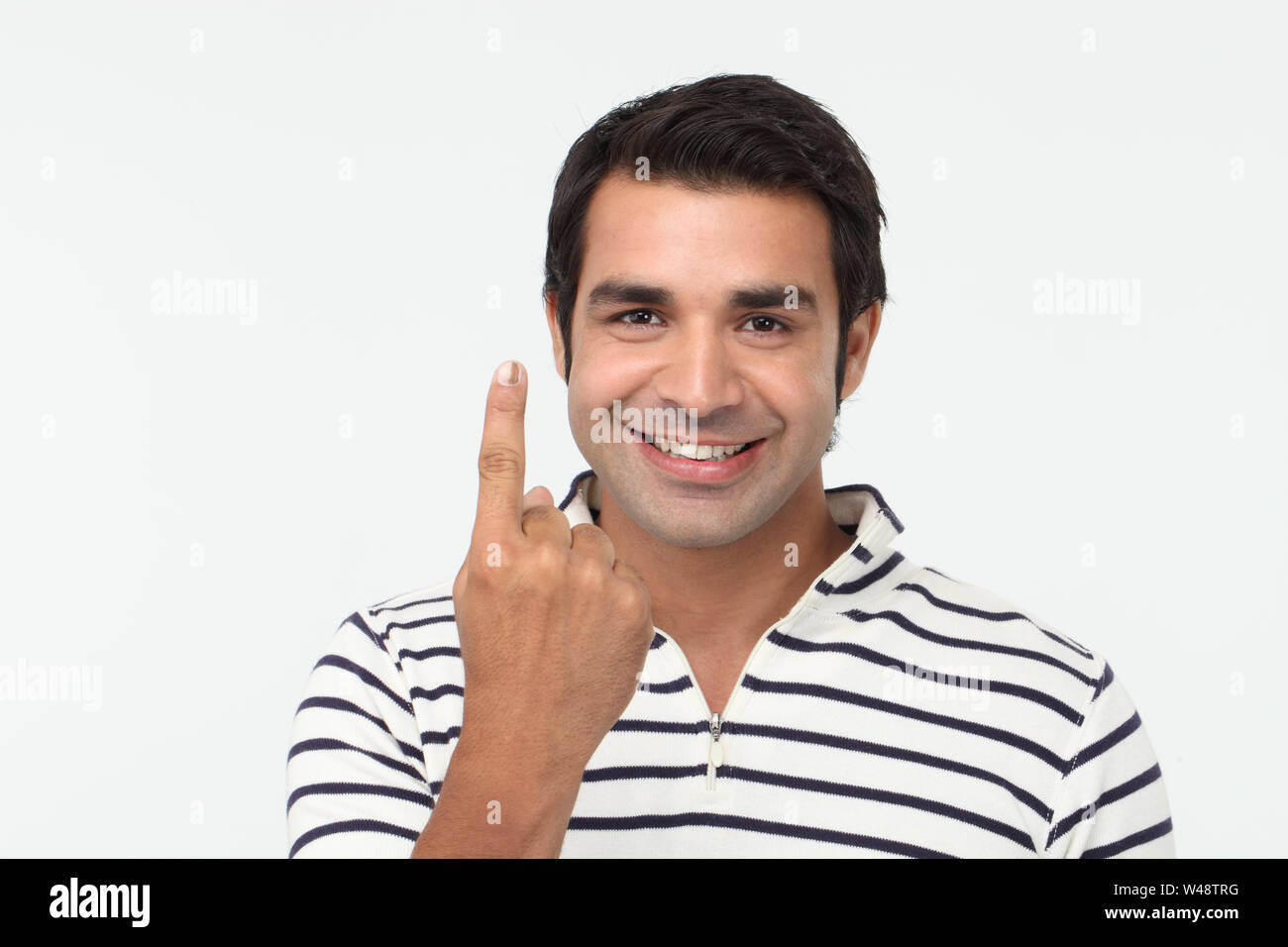 Portrait of a man pointing upward and smiling Stock Photo - Alamy