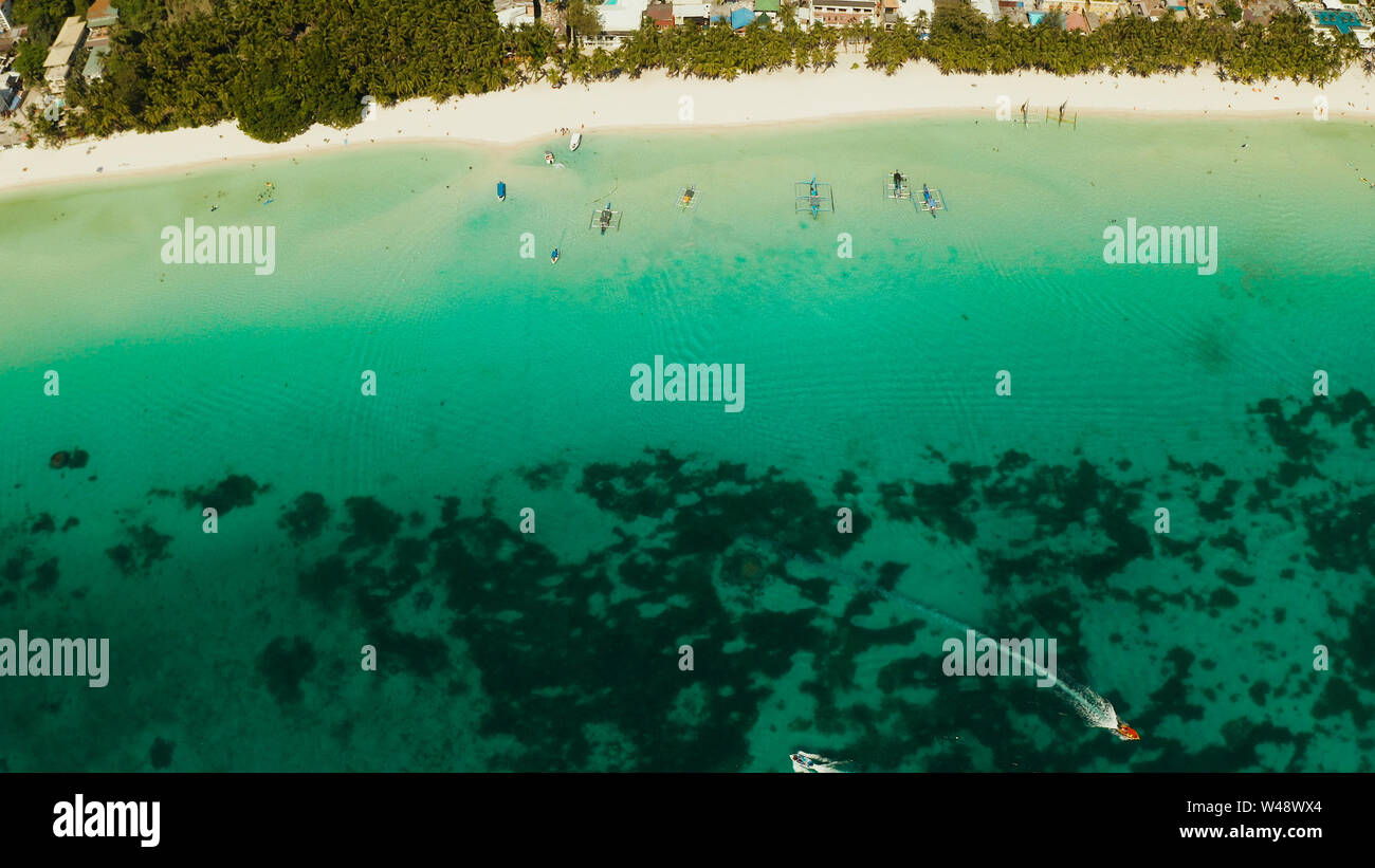 Tropical white sand beach in a lagoon with turquoise water on Boracay ...