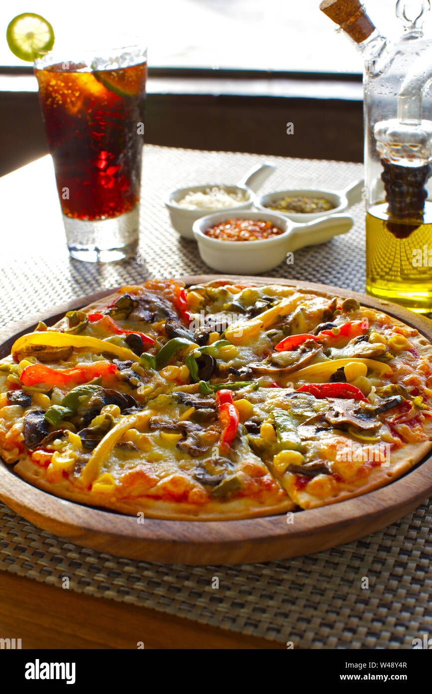 Pizza served with beverage Stock Photo - Alamy