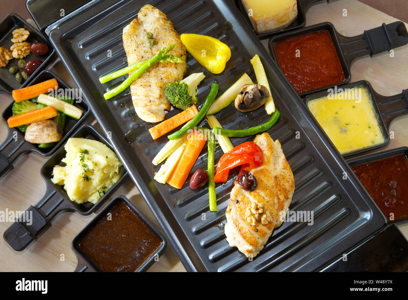 Grilled fish served with sauces Stock Photo - Alamy