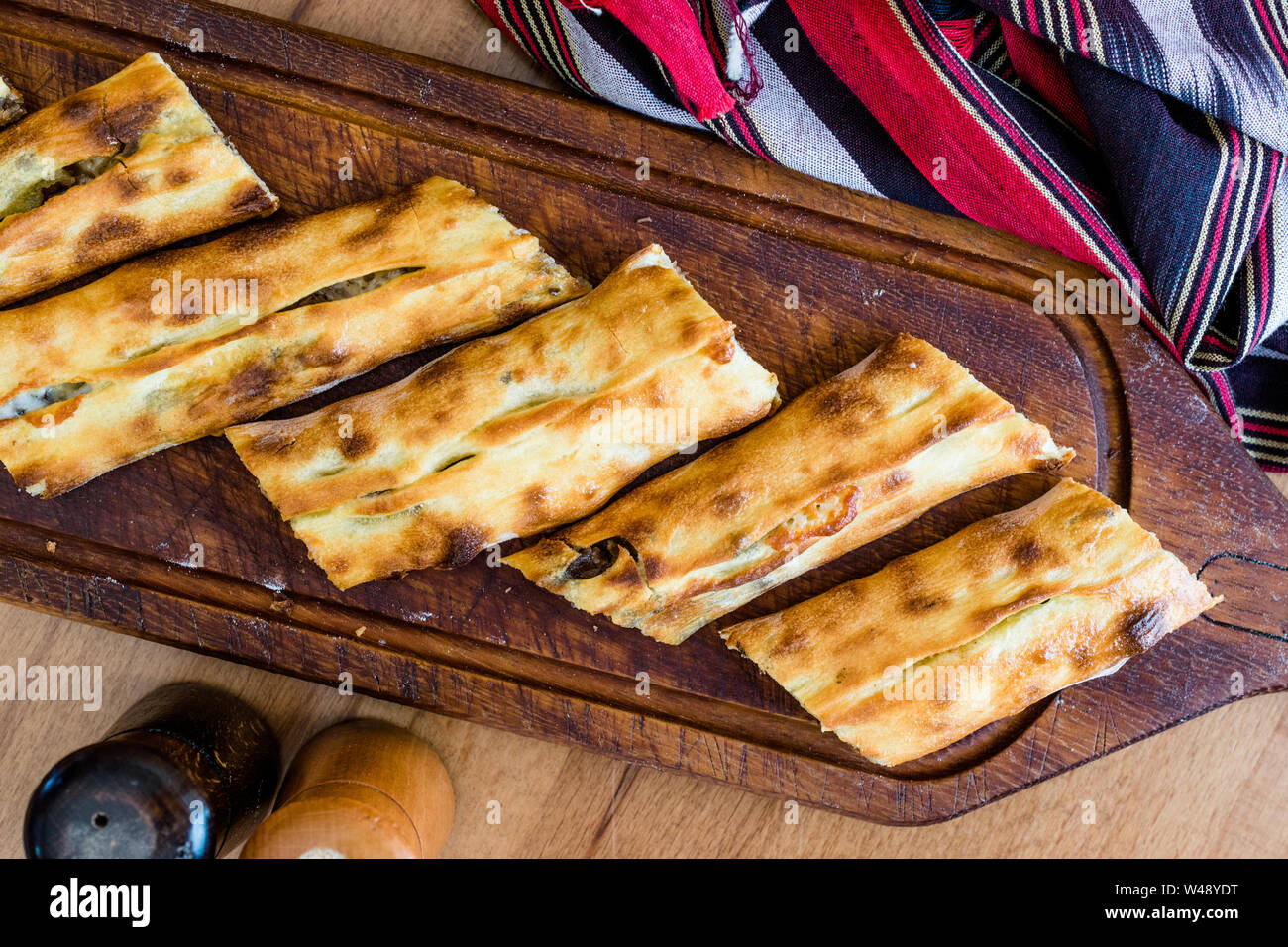 Traditional Turkish Pide at Kebab Restaurant on Wooden Table. Turkish ...