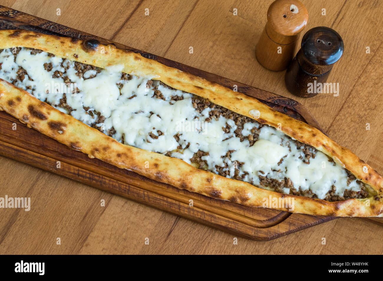 Traditional Turkish Pide at Kebab Restaurant on Wooden Table. Turkish ...