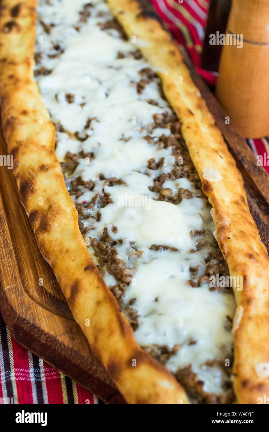 Traditional Turkish Pide at Kebab Restaurant on Wooden Table. Turkish ...