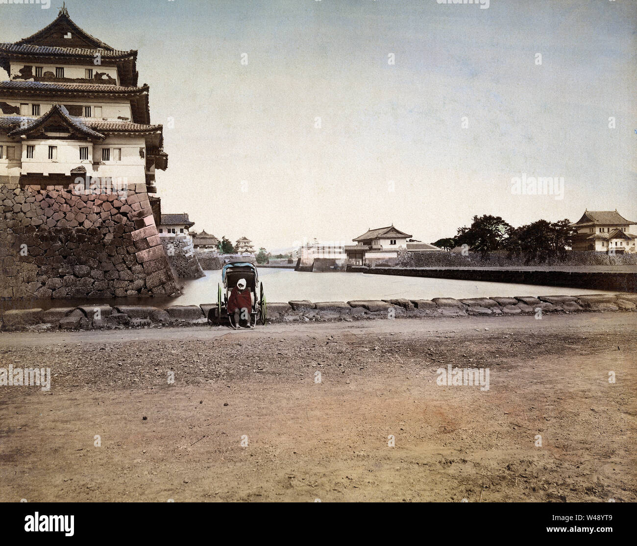 [ 1860s Japan - Imperial Palace in Tokyo ] — A rickshaw puller relaxes ...