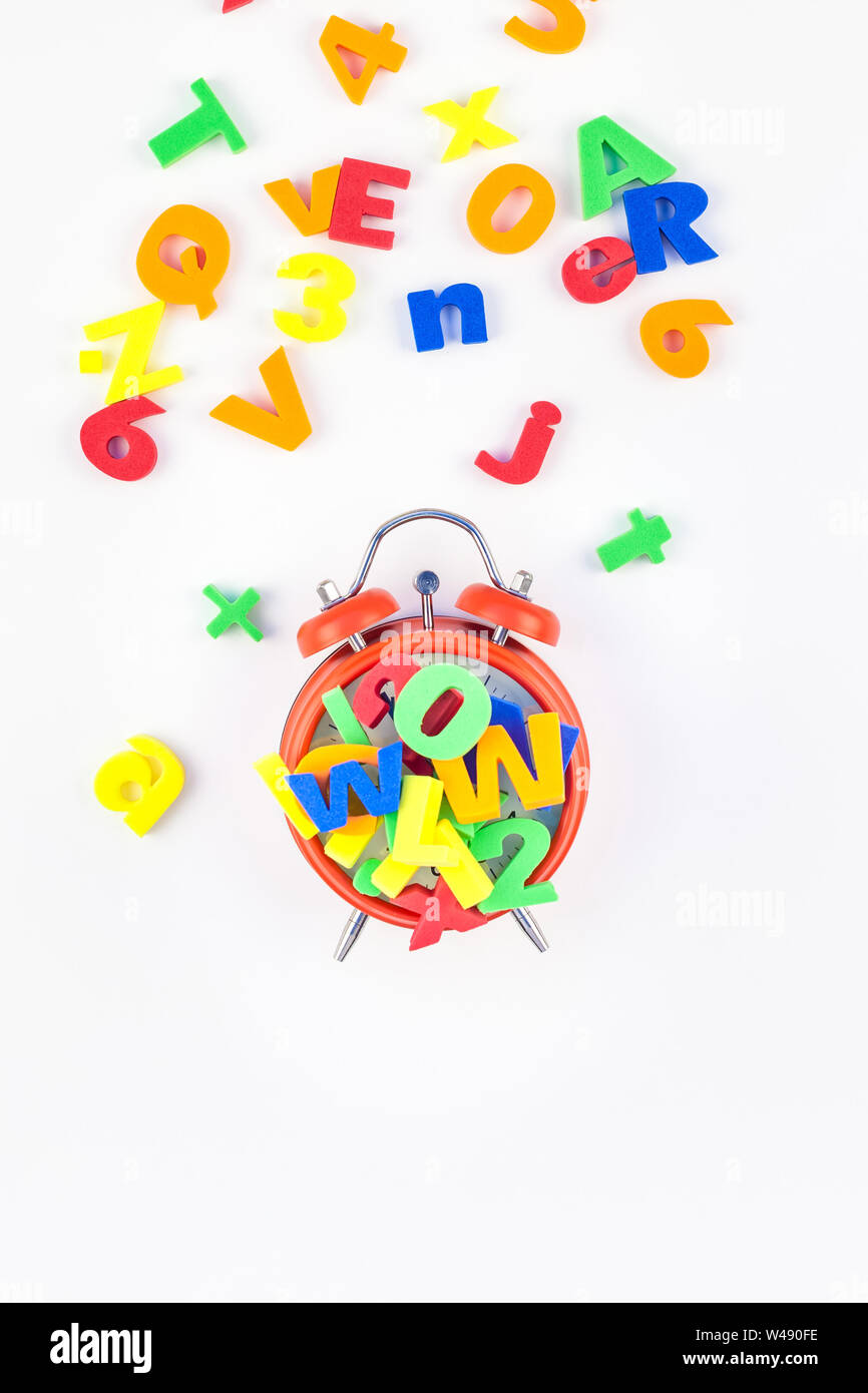 Creative flat lay back to school education concept with alarm clock and ...