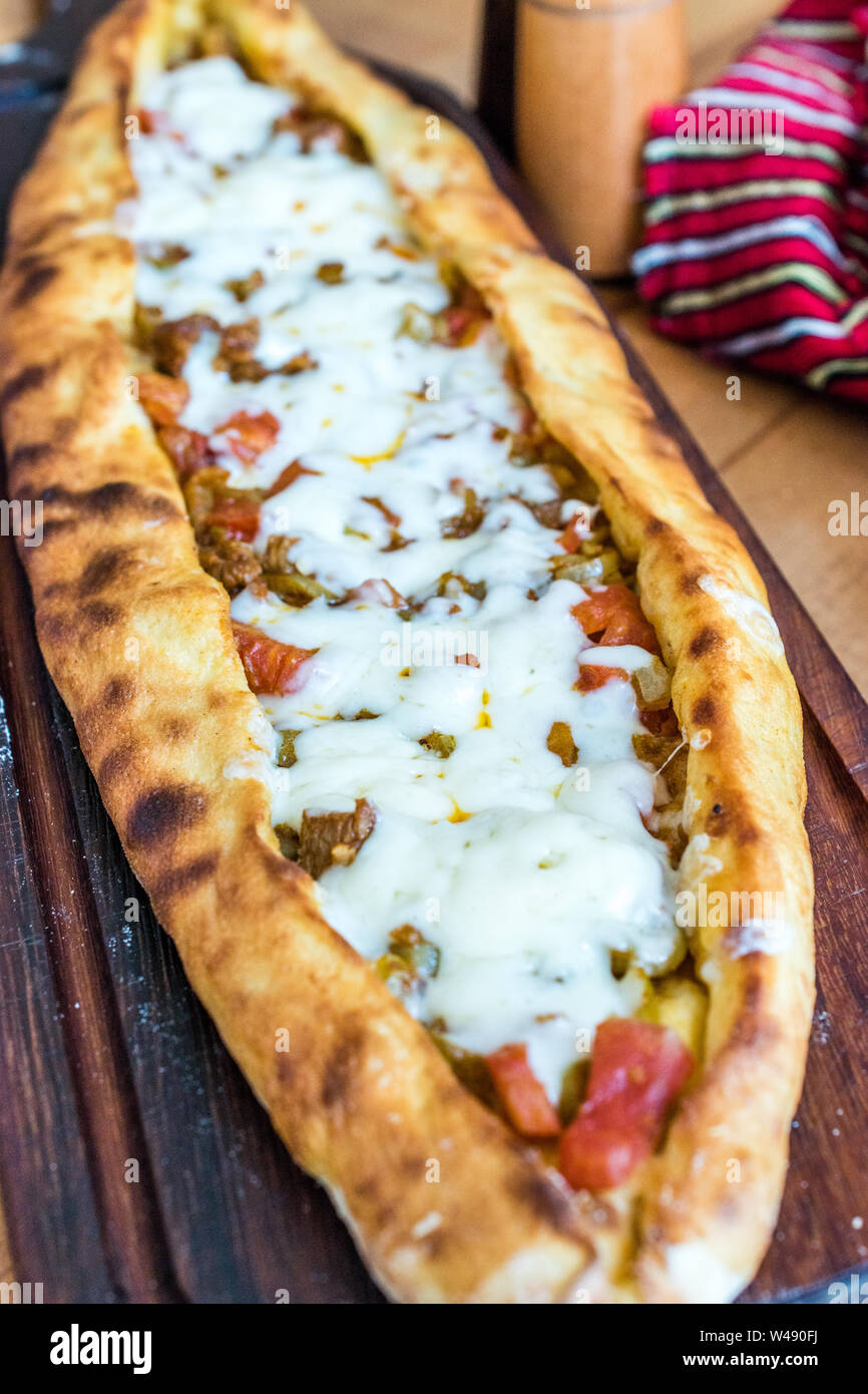 Traditional Turkish Pide at Kebab Restaurant on Wooden Table. Turkish ...