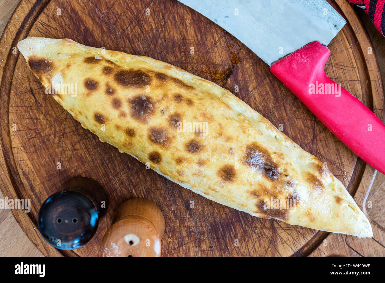 Traditional Turkish Pide at Kebab Restaurant on Wooden Table. Turkish ...