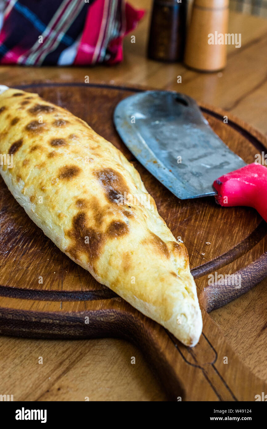 Traditional Turkish Pide at Kebab Restaurant on Wooden Table. Turkish ...