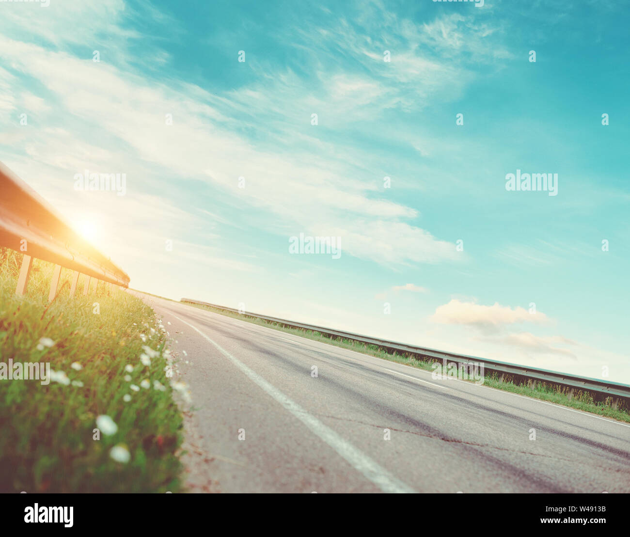 Summer road, sky, sun and clouds Stock Photo - Alamy