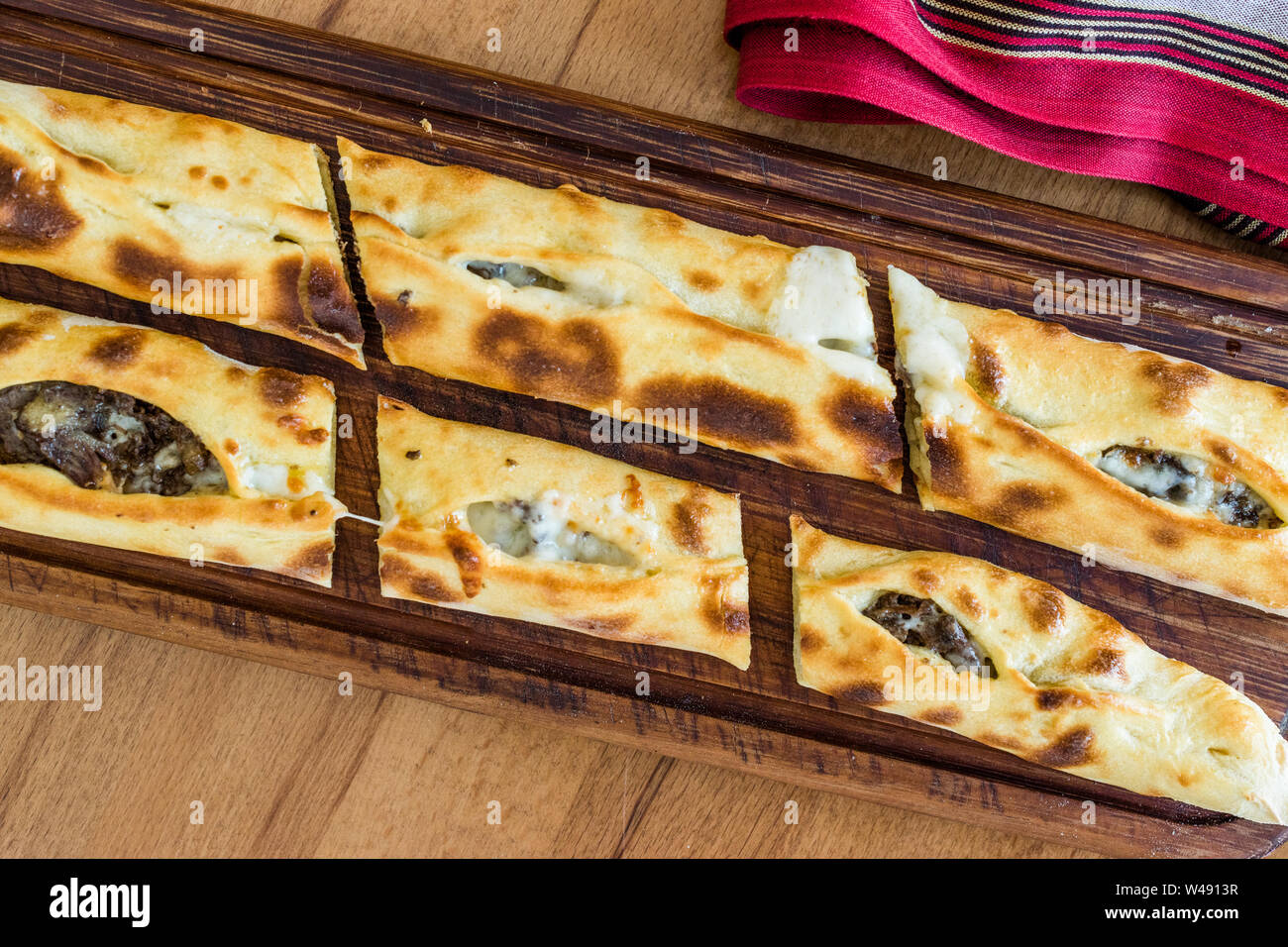 Traditional Turkish Pide at Kebab Restaurant on Wooden Table. Turkish ...
