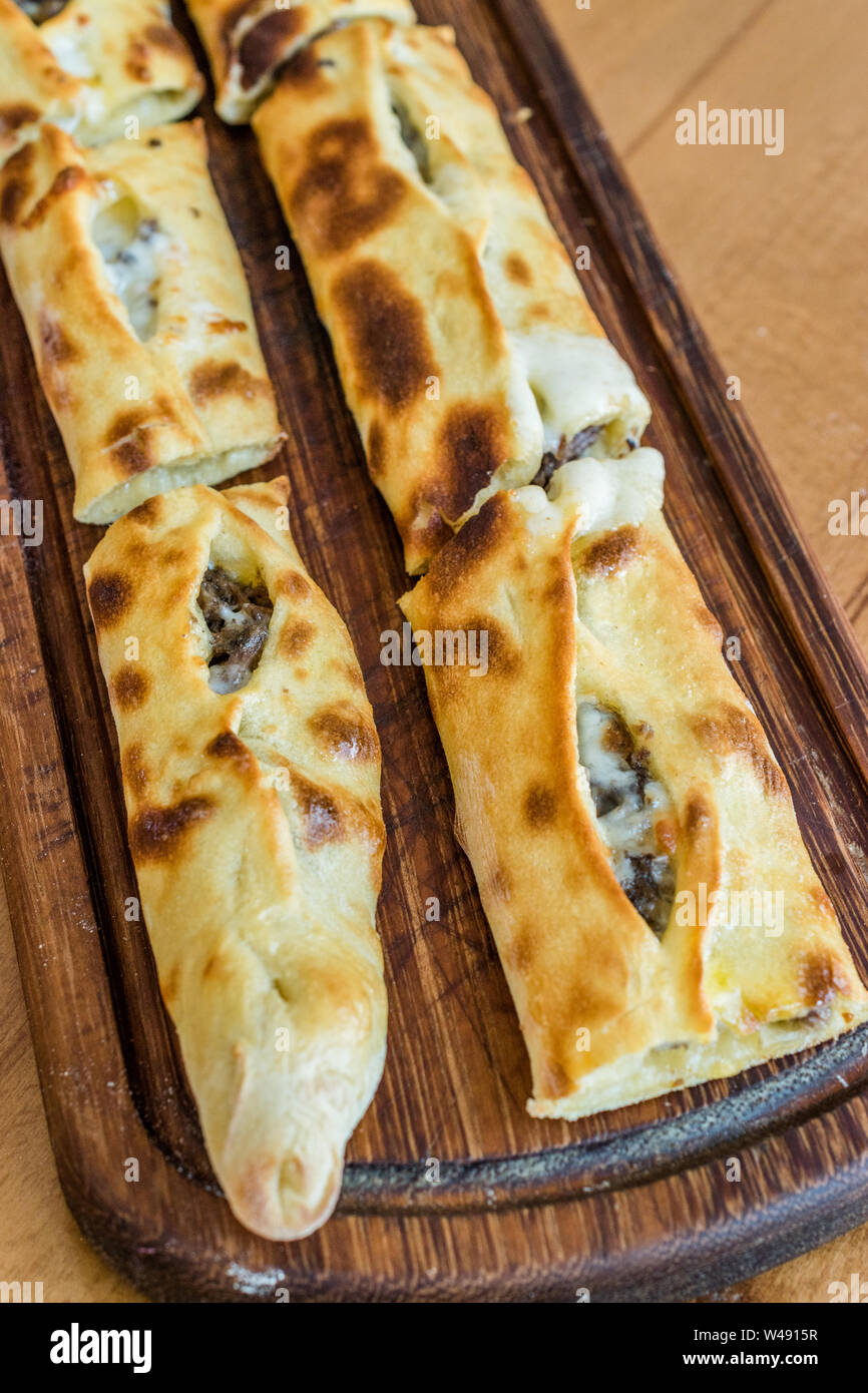 Traditional Turkish Pide at Kebab Restaurant on Wooden Table. Turkish ...