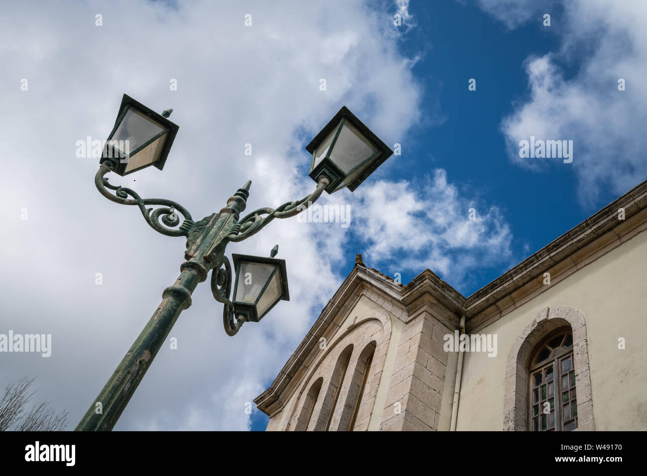 Three way lamppost in front of a small church in Agios Leon village ...
