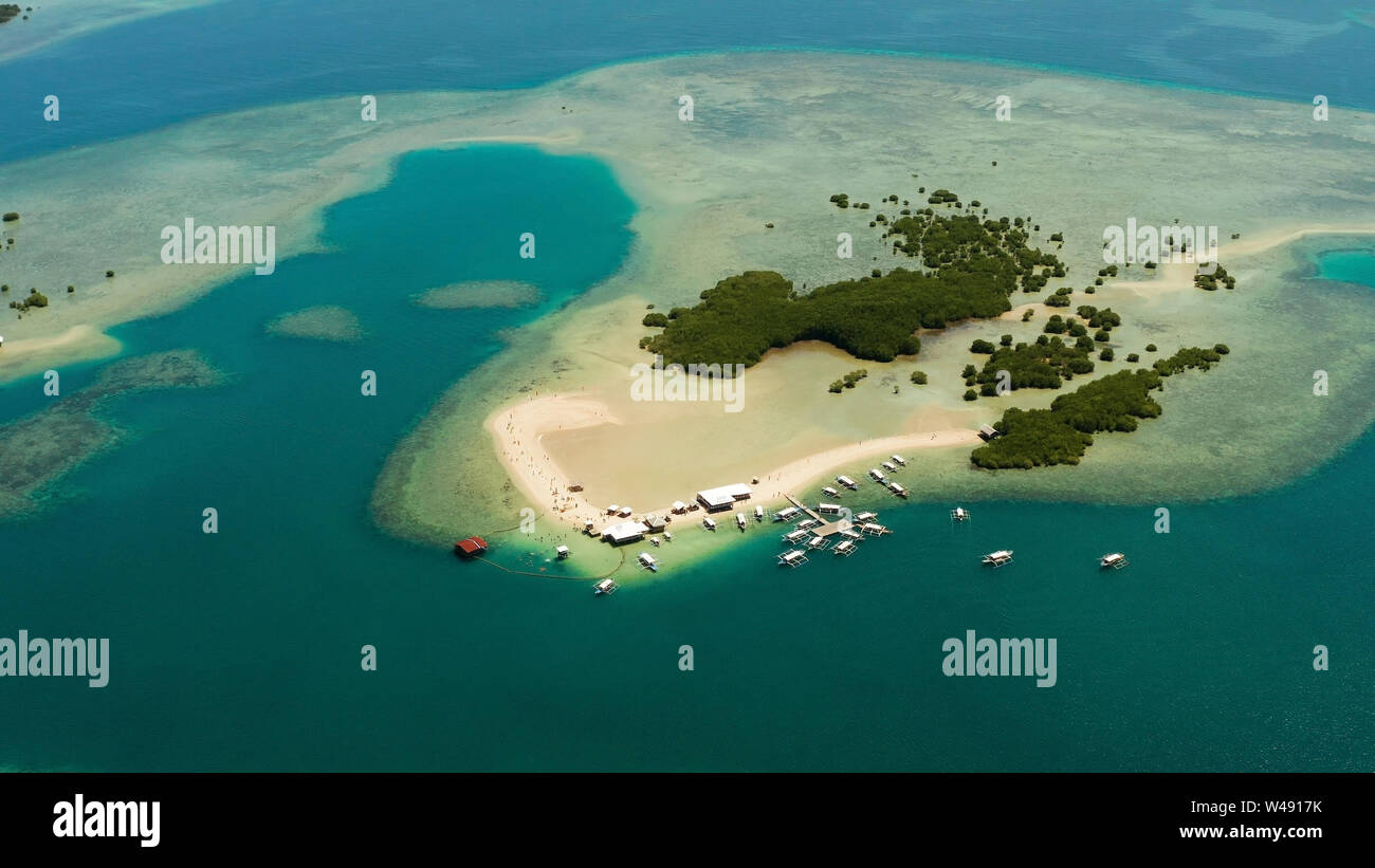 Beautiful beach on tropical island surrounded by coral reef, sandy bar ...