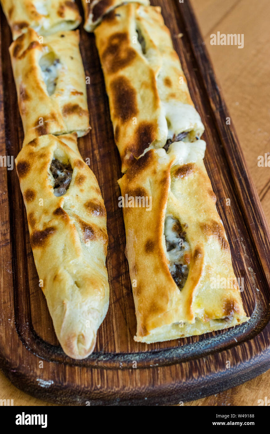 Traditional Turkish Pide at Kebab Restaurant on Wooden Table. Turkish ...