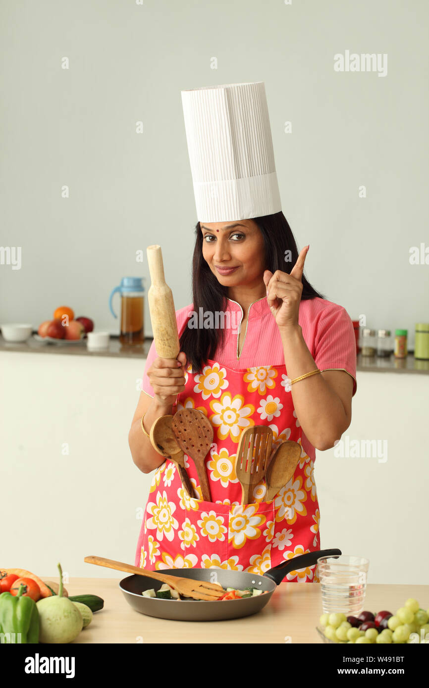 Chef pointing on recipe hi-res stock photography and images - Alamy