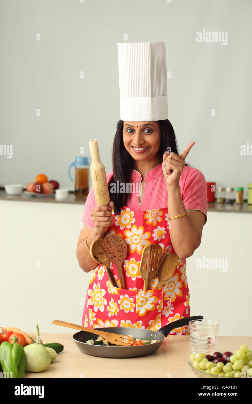 Female chef showing indian food hi-res stock photography and images - Alamy