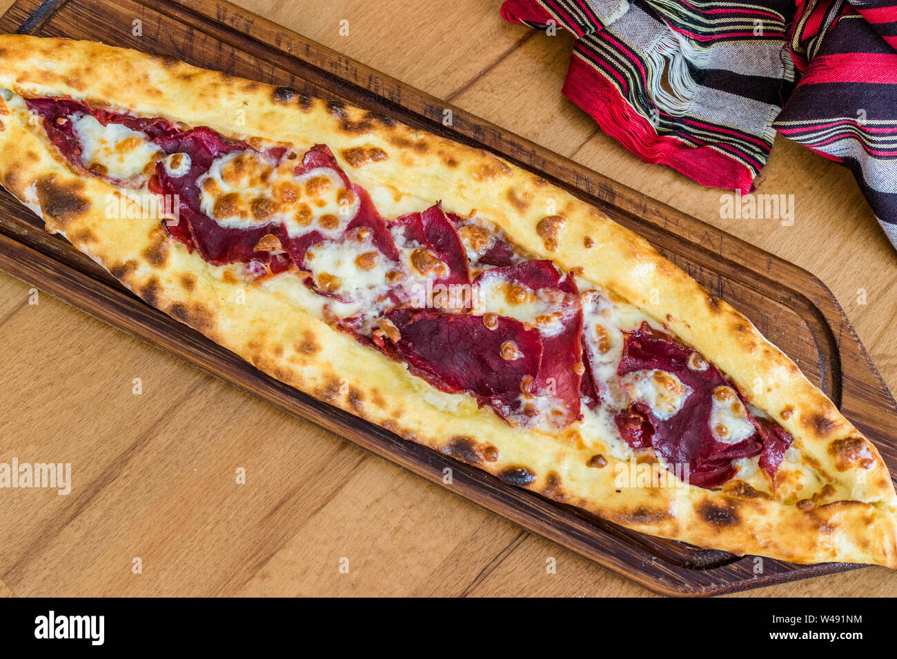 Traditional Turkish Pide at Kebab Restaurant on Wooden Table. Turkish ...