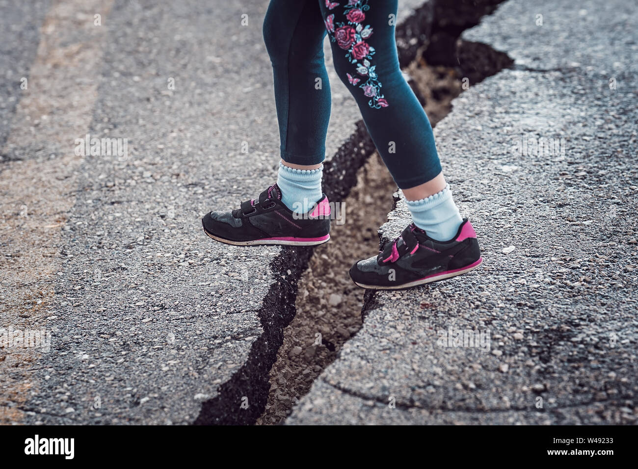 Jumping over crack hi-res stock photography and images - Alamy