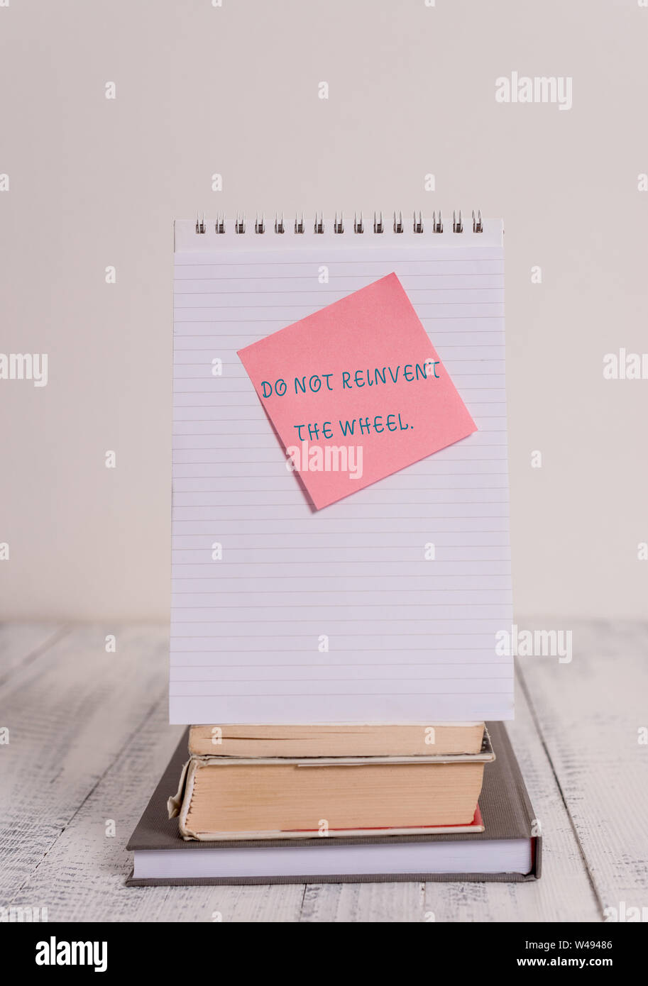 Writing note showing Do Not Reinvent The Wheel. Business concept for ...