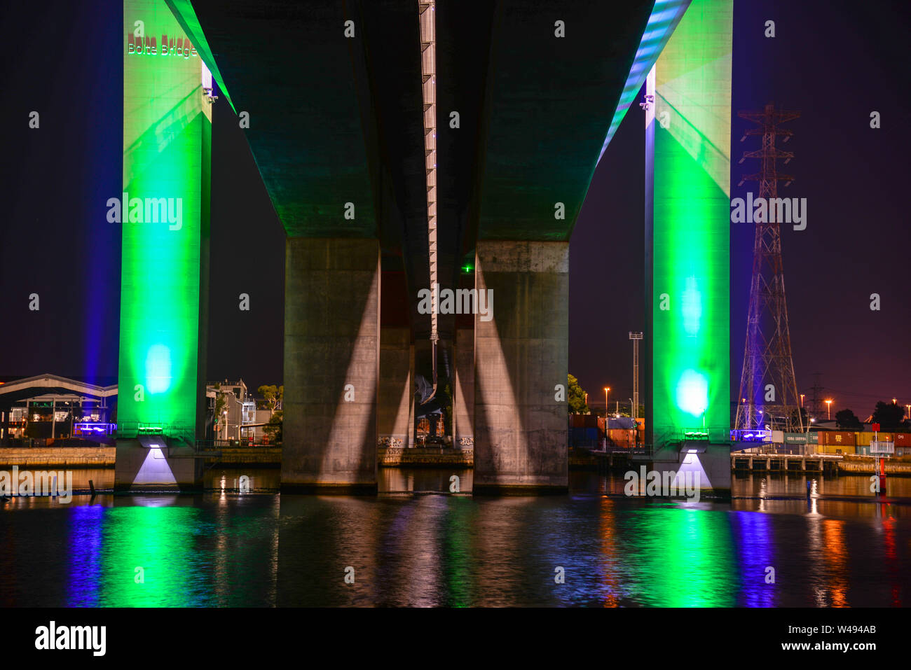 Bolte Bridge lit up green in night on Yarra River Victoria Harbour ...