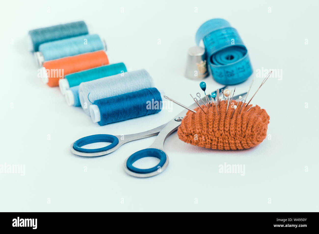 Tools for needlework, red knitted needle pad for sewing, scissors and ...