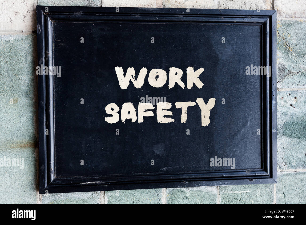 Writing note showing Work Safety. Business concept for policies and ...