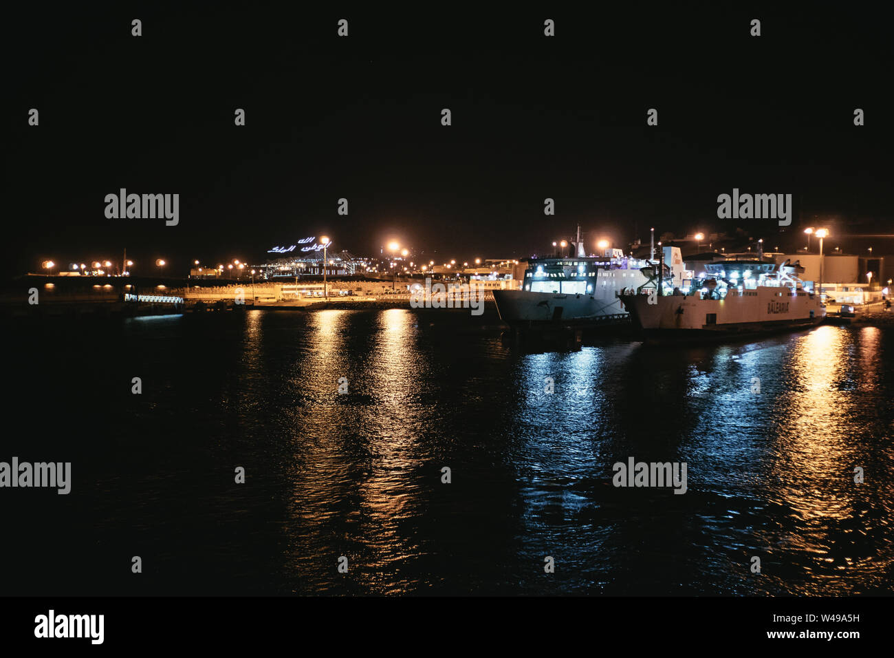 Ferries waiting at a cruise terminal at night Stock Photo - Alamy