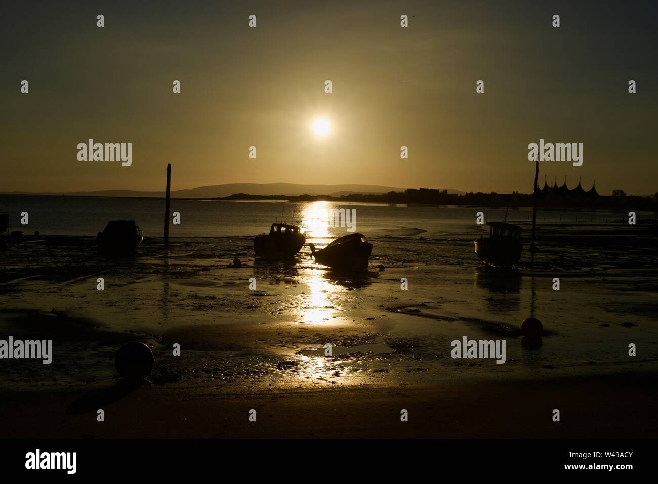 Stranded boats on beach Stock Photo - Alamy