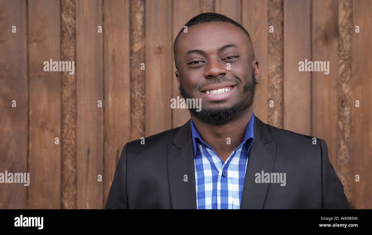 Portrait of young black bearded guy. Afro american man in suit is ...