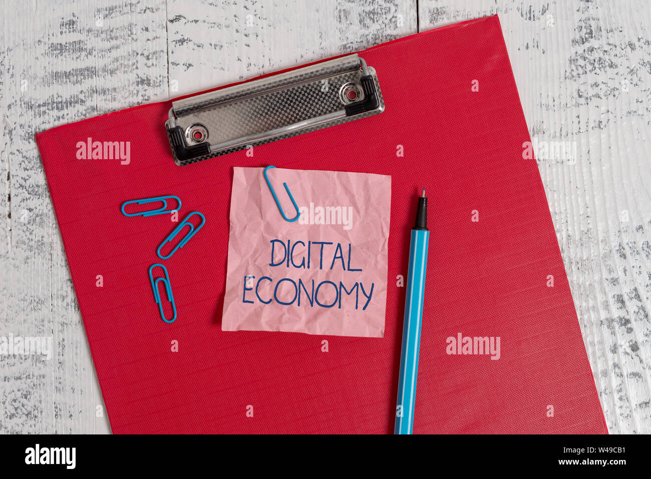 Writing note showing Digital Economy. Business concept for worldwide ...