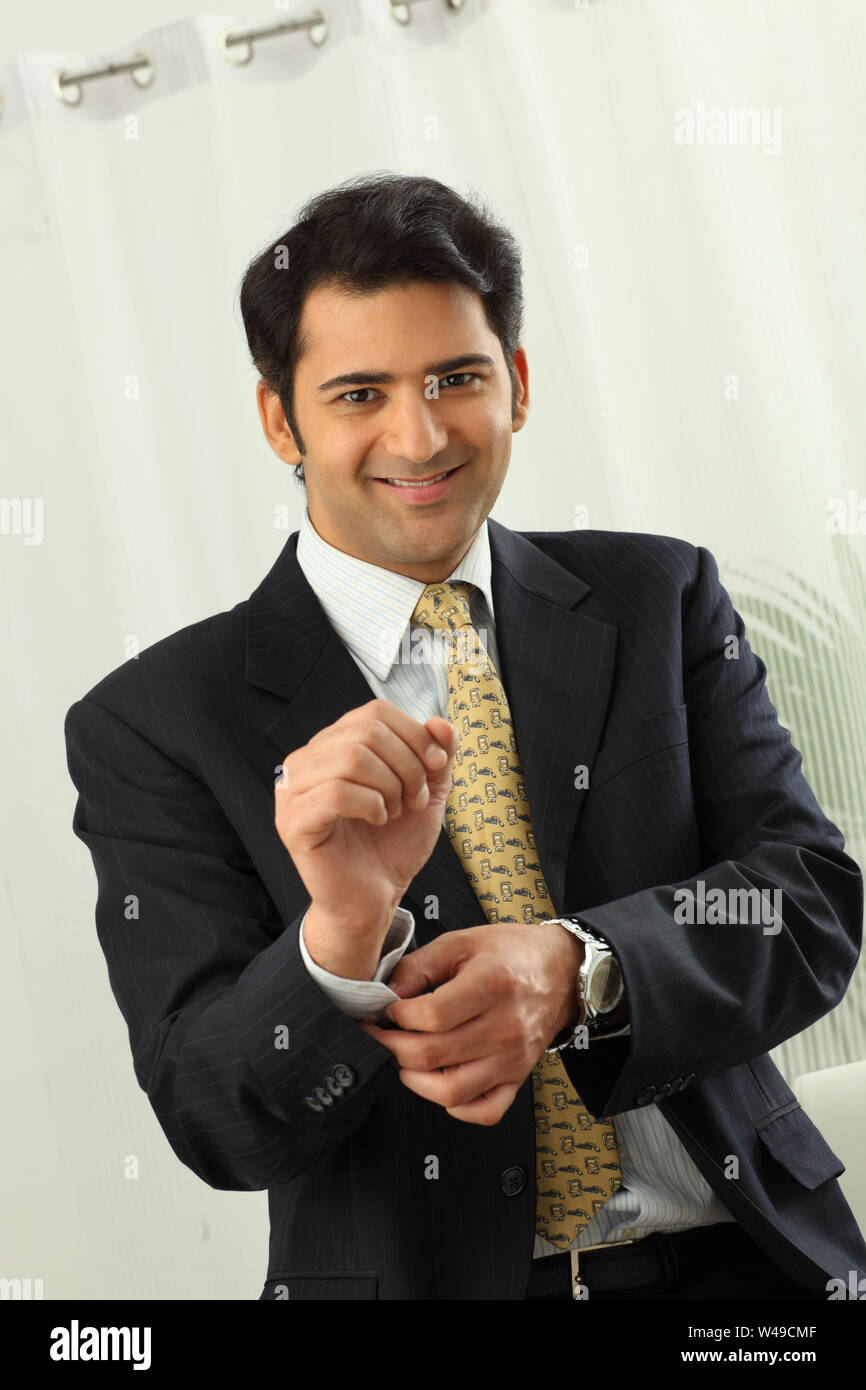 Businessman adjusting his cuffs hi-res stock photography and images - Alamy