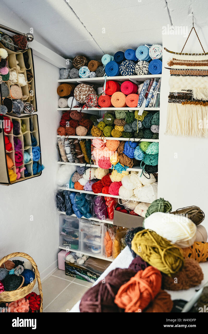 Supplies of colorful wool and yarn in a studio Stock Photo - Alamy
