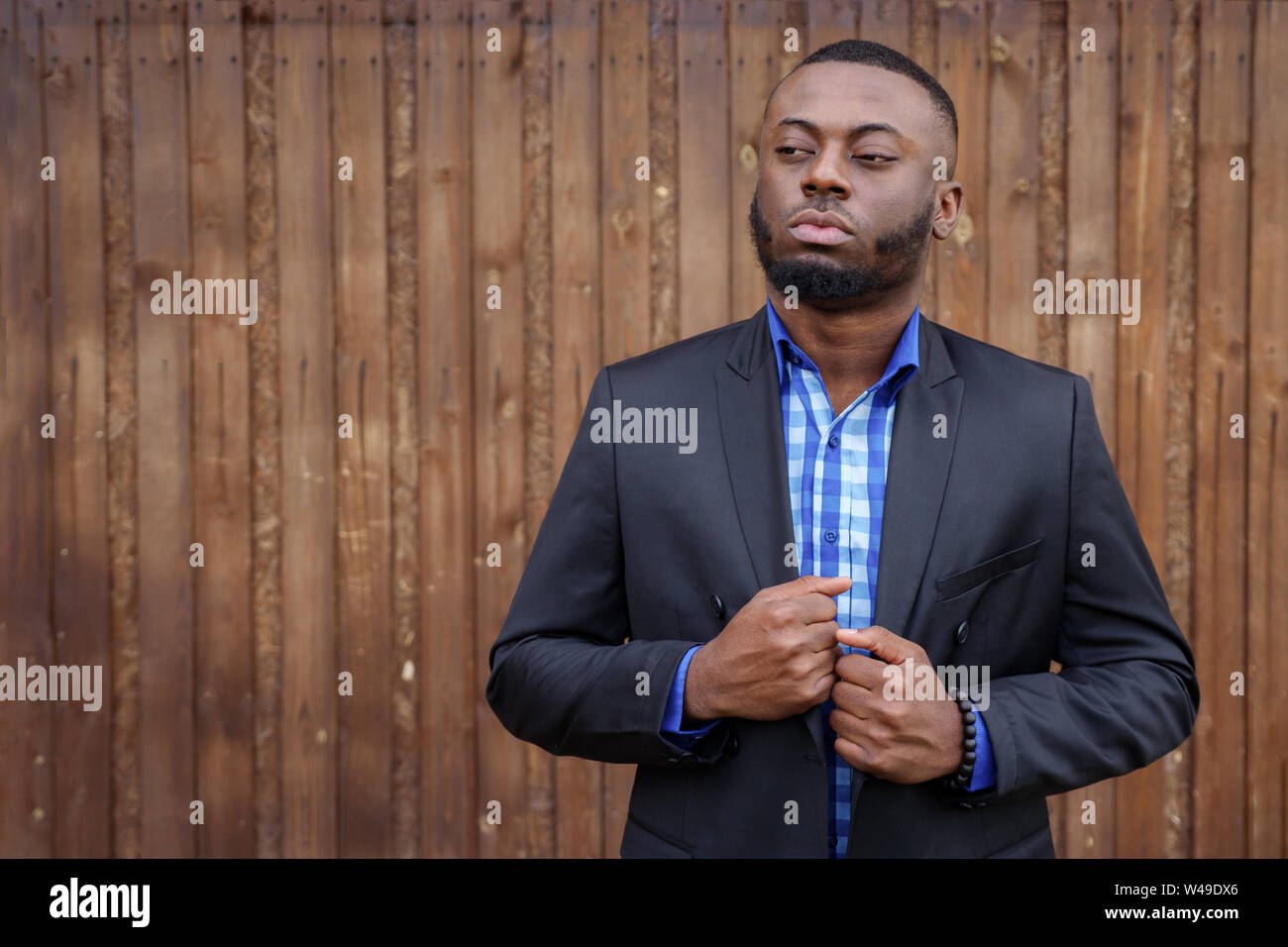 Portrait of young black bearded guy. Afro american man in suit is ...