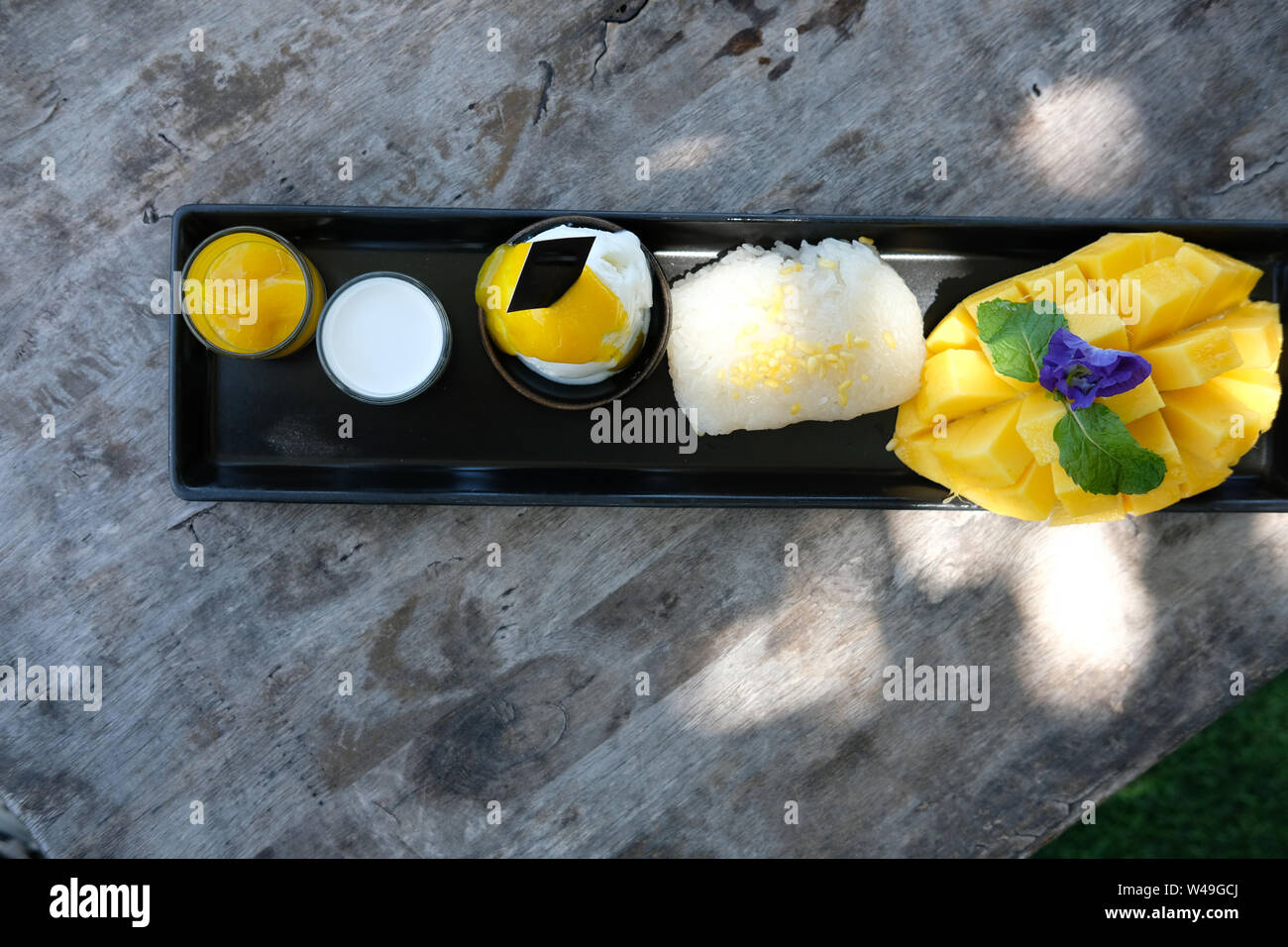 yellow mango sticky rice coconut milk. traditional Thai dessert Stock ...