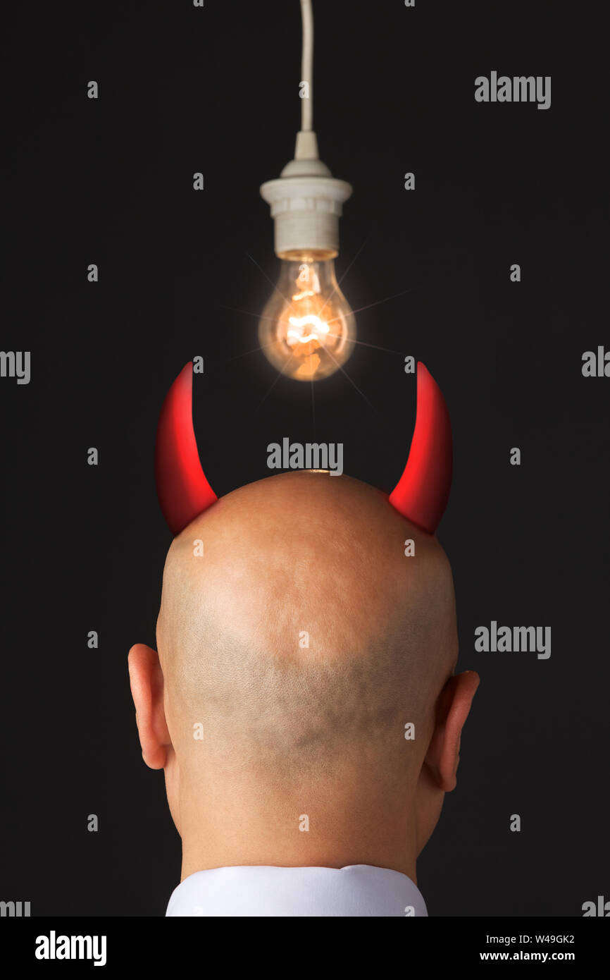 Close up of a devil with light bulb lit up over his head Stock Photo ...