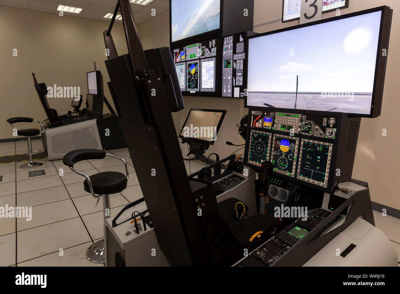 Fighter aircraft simulator training room. A flight simulator is a ...