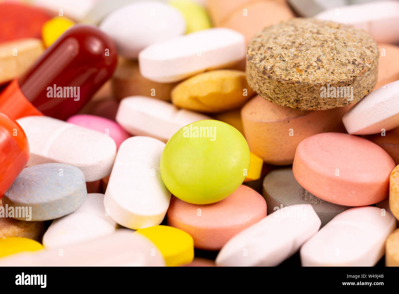 Different colorful pills and capsules. Global pharmaceutical industry ...