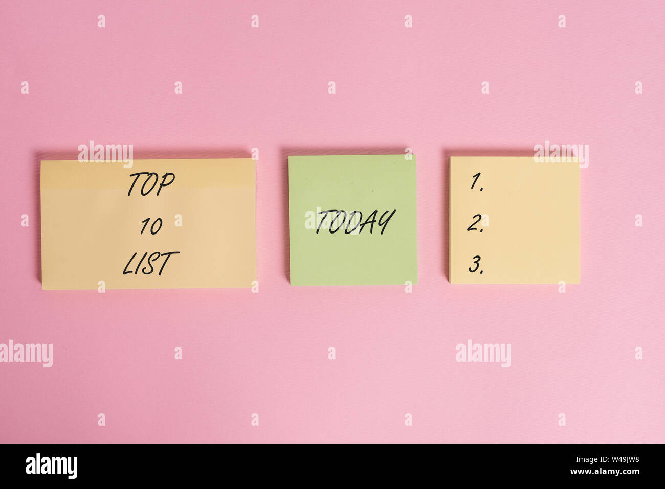 Writing note showing Top 10 List. Business concept for the ten most ...